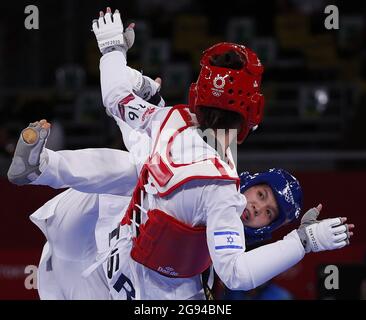 Vietnam's Truong Thi Kim Tuyen (blue) competes against Israel's Avishag ...
