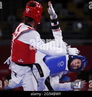 Vietnam's Truong Thi Kim Tuyen (blue) competes against Israel's Avishag ...