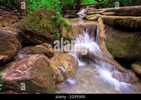 Limestone waterfall in tropical forest, west of Thailand Stock Photo ...