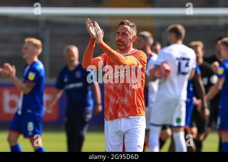 Richard Keogh of Blackpool applauds the traveling fans after the game ...
