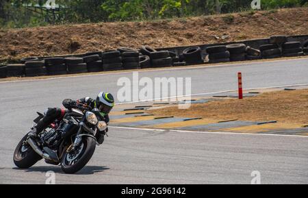 man practising laps on race track with his motorcycle Stock Photo - Alamy