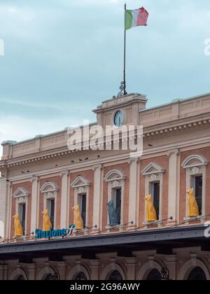 Sculptures of Yellow and Gray Wolves Leaning Against the Outside of ...