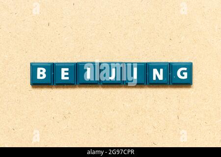 Tile alphabet letter with word beijing in red color rack on wood ...