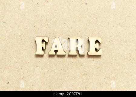 Alphabet letter in word fare on old red color wood plate background ...