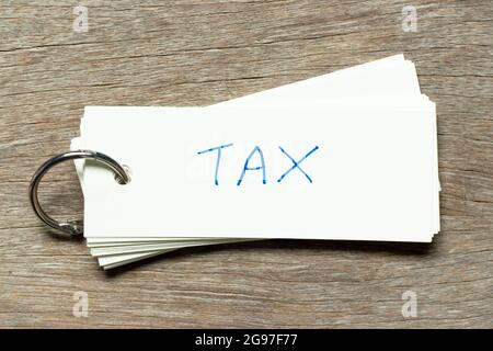 Flash card with handwriting word VAT (abbreviation of value added tax ...