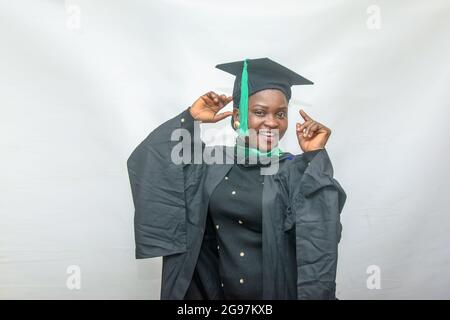 Portrait of a happy African female graduand or graduating students ...