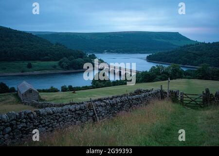 Aerial view of Ladybower Reservoir with scenic countryside and blue sky ...