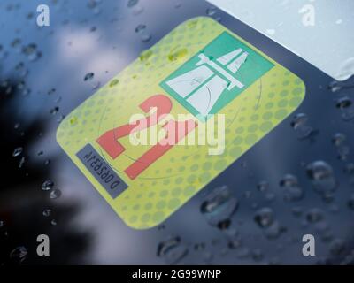 Swiss motorway toll sticker ("Vignette") at the windshield of a car in ...