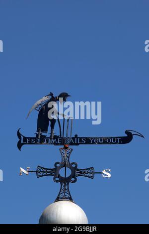 Weathervane bearing the words, "Lest time bails you out" above a ...