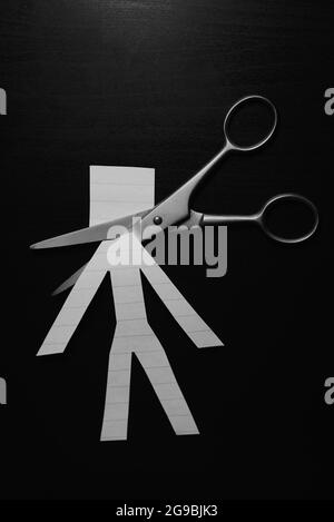 Cutting head of paper person. Murder concept Stock Photo - Alamy