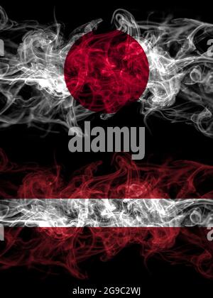 Latvia and Japan flag waving in the wind against white cloudy blue sky ...