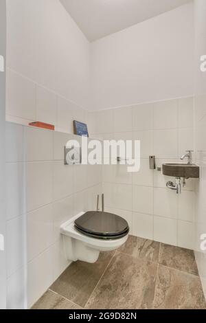 Interior of small clean washroom in miniature style Stock Photo - Alamy