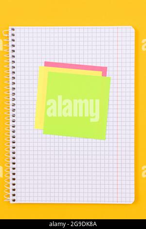A Notepad with Sticky Notes Lying on Yellow Table - Blank Template. Top ...