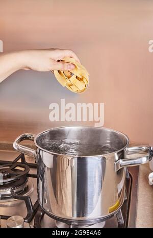 Teenager tossed pasta into boiling water for spaghetti bolognese using ...