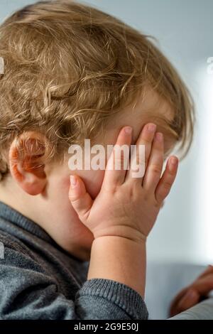 After the little boy wakes up from his nap, his father and mother ...