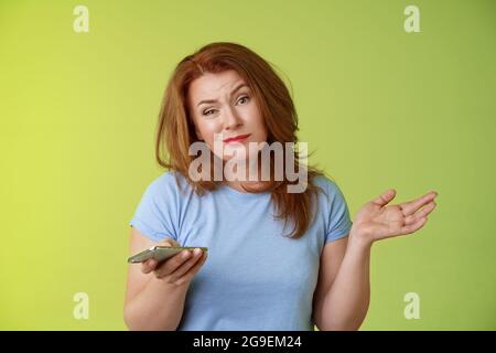 Well meh. Indifferent careless hesitant redhead middle-aged woman ...