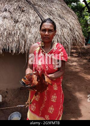 BHUBANESWAR, INDIA - Jul 15, 2021: A vertical shot of a tribal woman ...