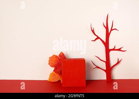 Modern Autumn podium with decor falling leaves on red background Stock ...