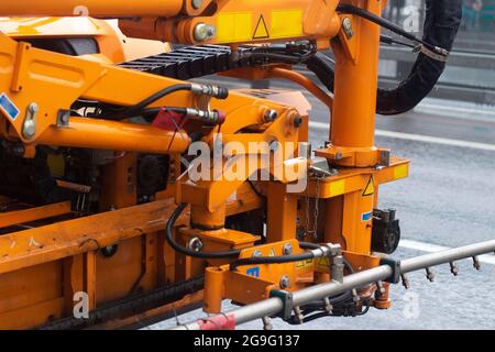 Mechanical road and pavement sweeper at work Stock Photo - Alamy