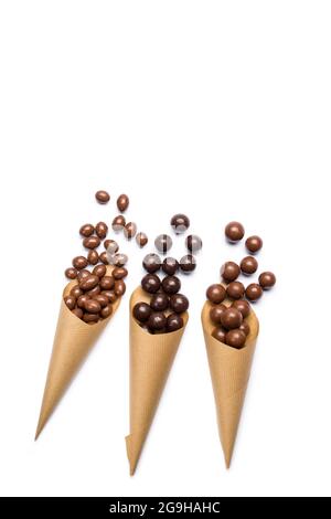 Closeup of chocolate cones on a white plate Stock Photo - Alamy