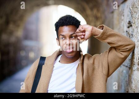 Young Cuban man standing in the street Stock Photo - Alamy