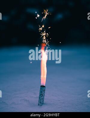 Vertical shot of an exploding firework on a floor Stock Photo - Alamy