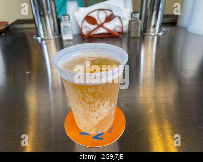 An icy cold draft beer in a glass sitting on a bar in Florida Stock ...