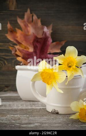 Chic autumn bouquet in red colors in vintage style in a glass vase and ...
