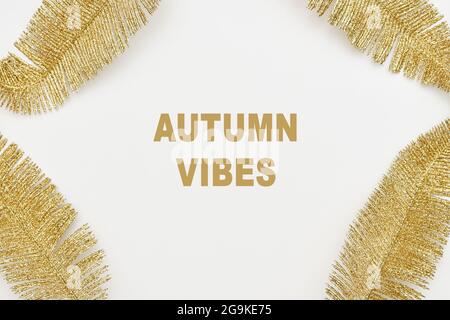 Decorative golden autumn leaves. Fake autumnal leaves on white ...