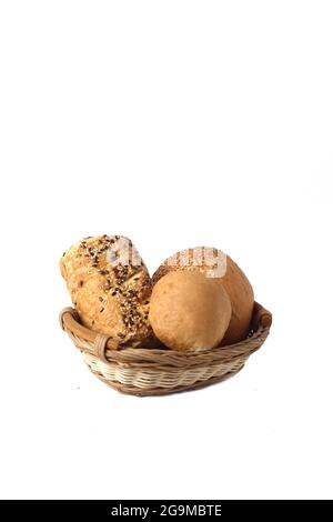 three buns of different kinds on wooden plate isolated on gray ...