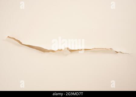 the longitudinal tear of a cardboard Stock Photo - Alamy