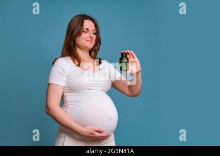 Body oil for pregnant woman, studio shot on white background Stock ...