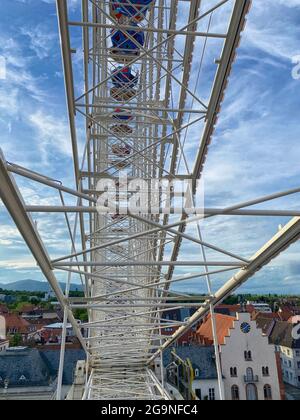 View of Inside of Ferris Wheel view of the structure with cabins. The ...