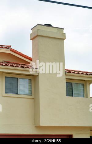 Chimney of a building with shingles roof Stock Photo - Alamy