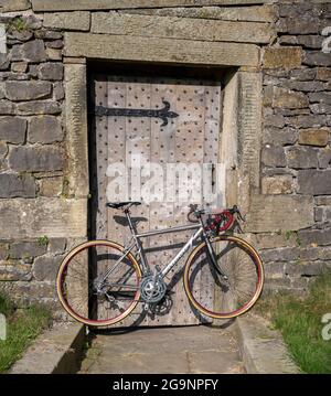 Airborne titanium road bike in an olive grove beneath Mont Ventoux ...