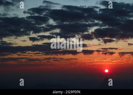 sundown with mountain and silouette hill Stock Photo - Alamy