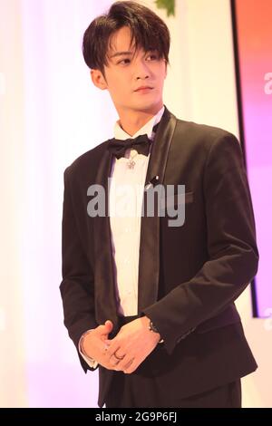 Chinese actor and singer Tan Jianci arrives at a Beijing airport after ...