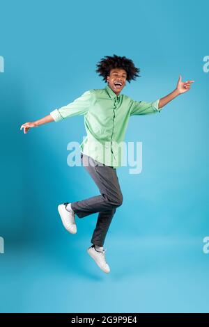 Cheerful funny man dancing in bow-tie and suspenders, pointing fingers ...