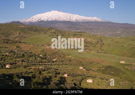 cultivated land and majestic of volcano Etna snow covered, Sicily Stock ...