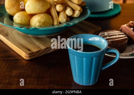 Coffee with cheese bread and cheese sticks. Typical Brazilian breakfast ...