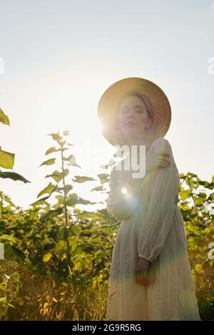 Caucasian woman standing over yellow background standing backwards ...