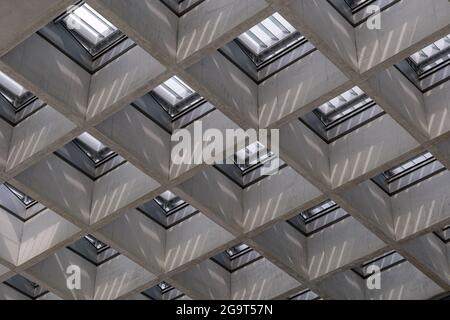 Low angle view of skylight with rectangular grid pattern over atrium ...