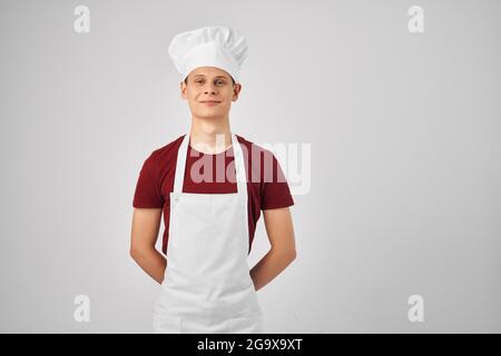 chefs in professional clothes gesturing with hands on a light ...