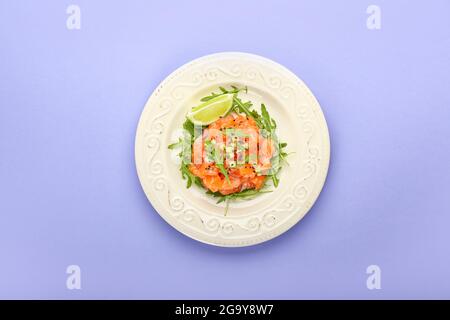Delicious salmon tartar on color background Stock Photo - Alamy
