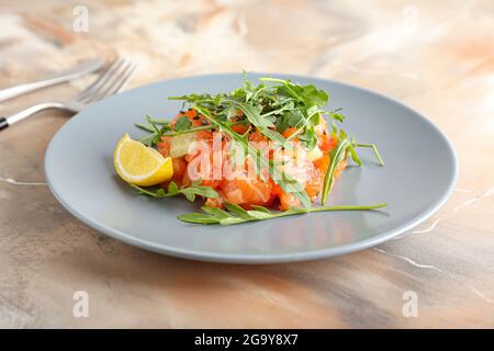 Delicious salmon tartar on grunge background, closeup Stock Photo - Alamy