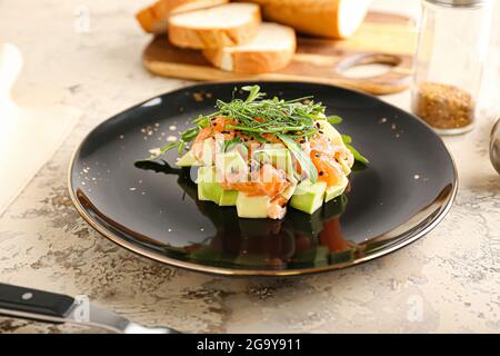 Delicious salmon tartar on grunge background, closeup Stock Photo - Alamy