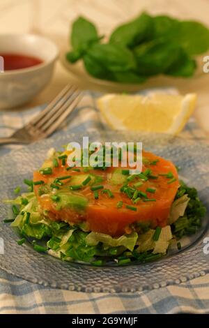 Delicious salmon tartar on color background Stock Photo - Alamy