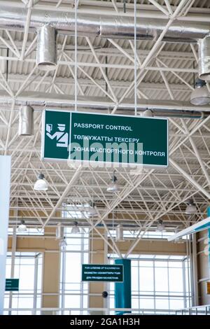 Customs control zone sign with green letters on metal fence, warning ...