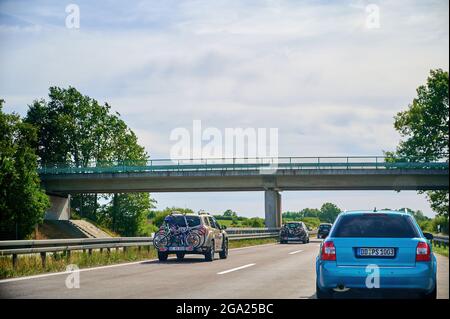 Freeway 11, Germany - September 15, 2019: Car with a bike carrier attached to the stern and ...