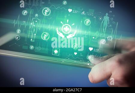Close-up of a touchscreen with healthcare icons Stock Photo - Alamy